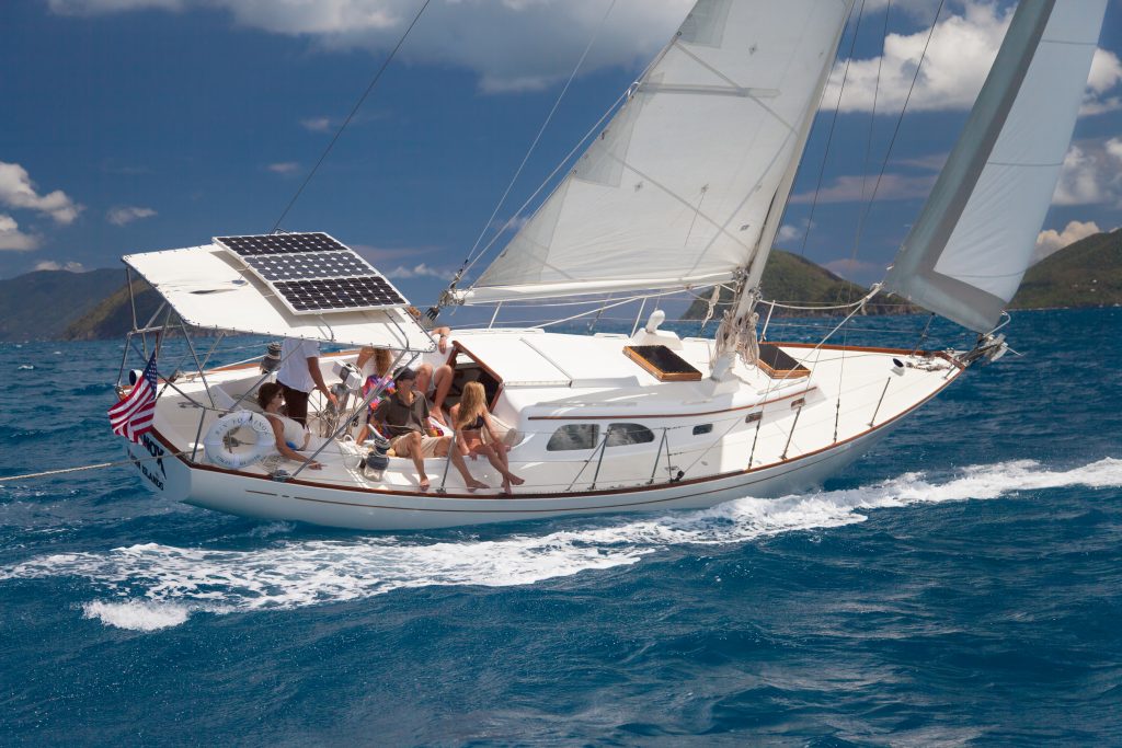 sloop under full sails sailing through the US Virgin Islands ...